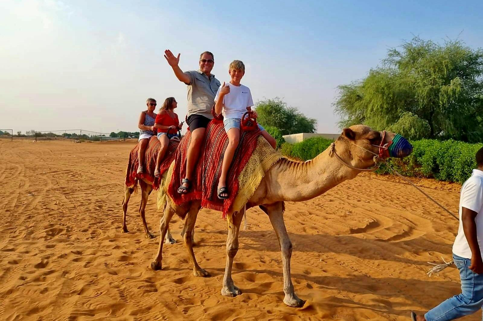 Dubai Desert: Camel Ride Safari in Red Dunes ใน ดูไบ | Pelago