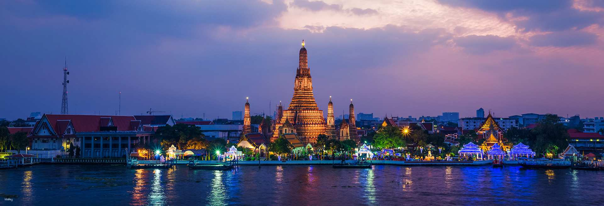 Sail the Chao Phraya River admiring illuminated landmarks like Wat Pho ...